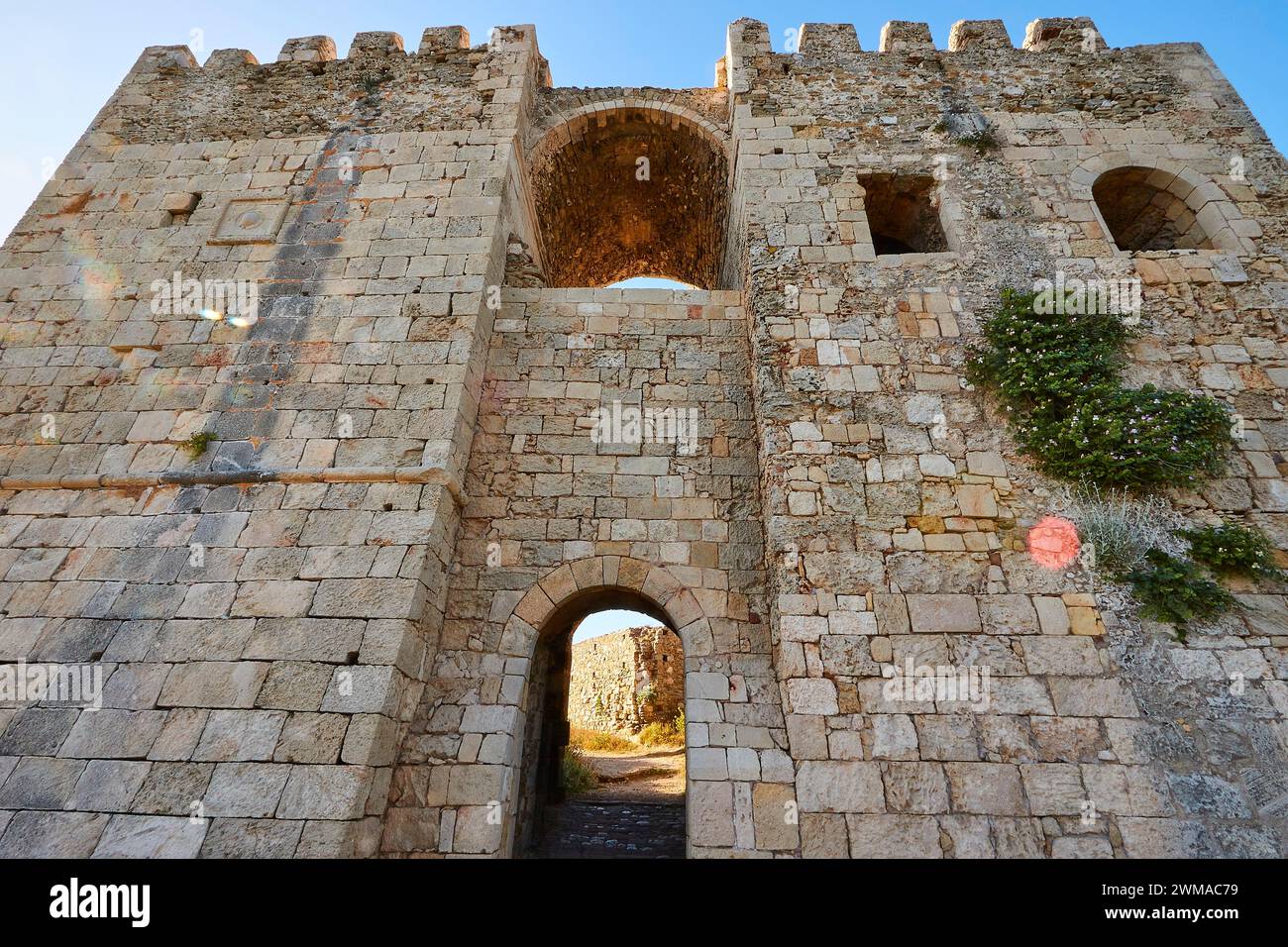 Stone gate of a medieval fortress under a clear sky, sea fortress ...