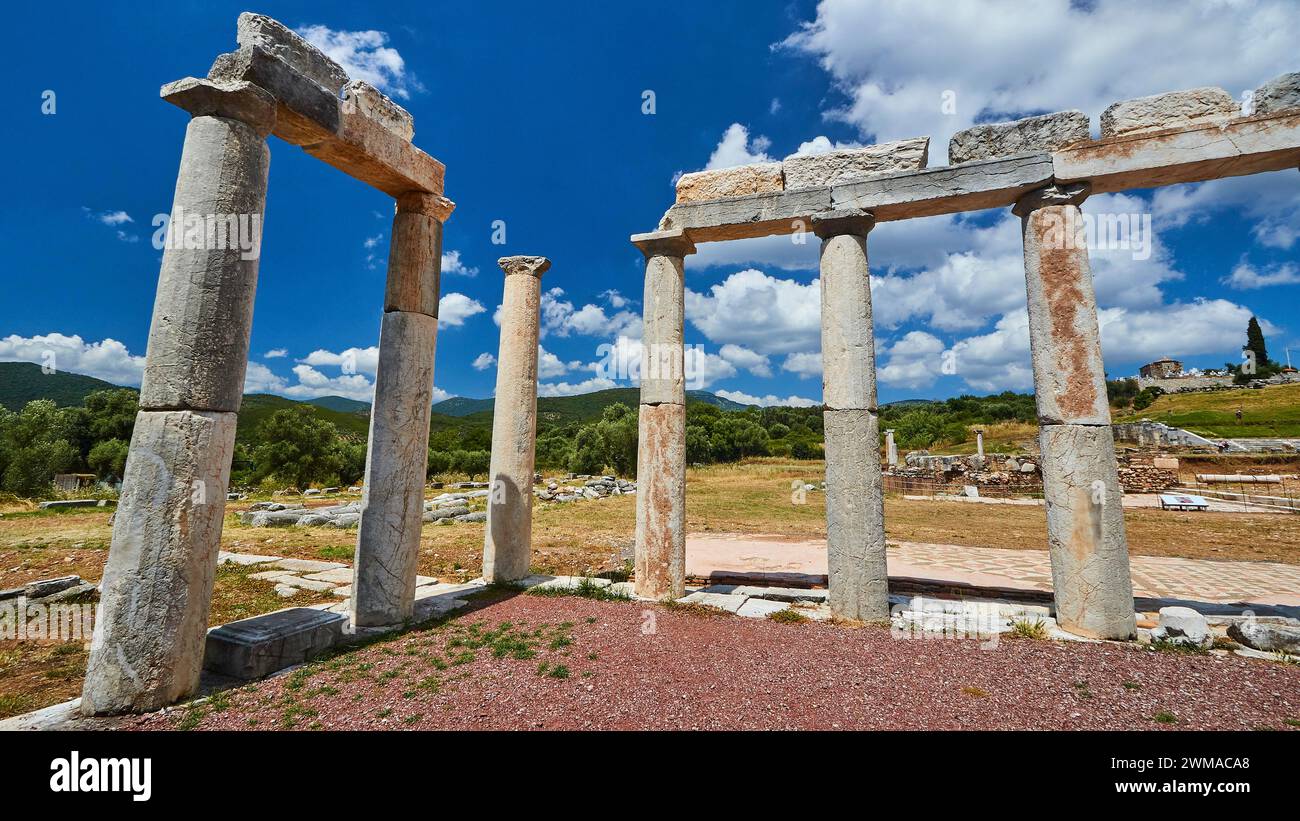 The remains of an ancient columned structure on a sunny day, Stoa of ...