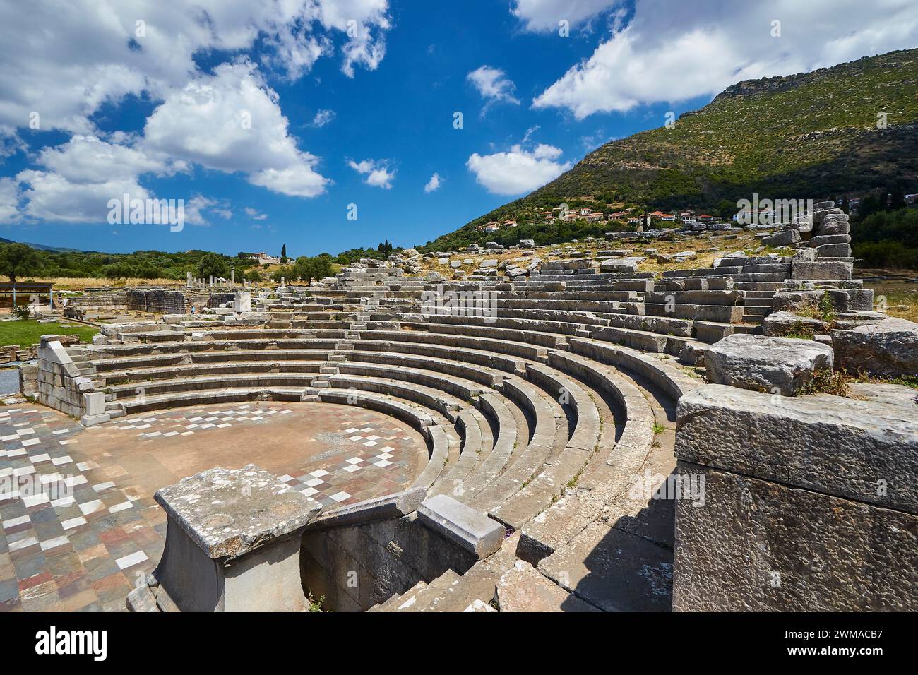 Ancient amphitheatre with stone seats and ruins in Greece, sanctuary of ...
