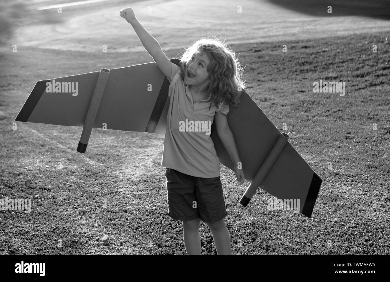 Kid superhero with jetpack. Child pilot play on summer day. Success ...