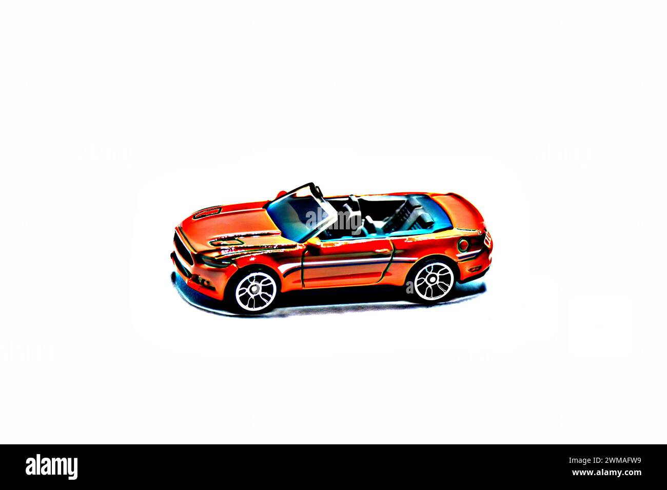 Red convertible toy car on white background Stock Photo - Alamy
