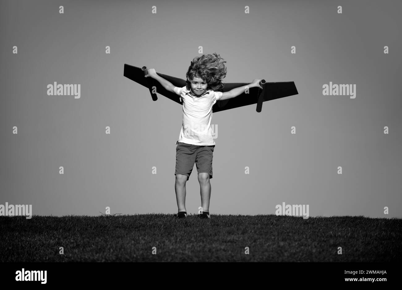 Child boy playing pilot on the sky blue background. Kid dreaming. Child ...