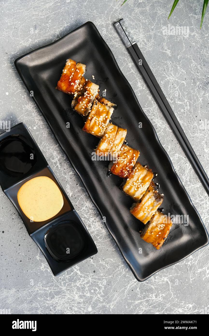 Rainbow Sushi Roll with salmon, eel, tuna, avocado, royal prawn, cream ...