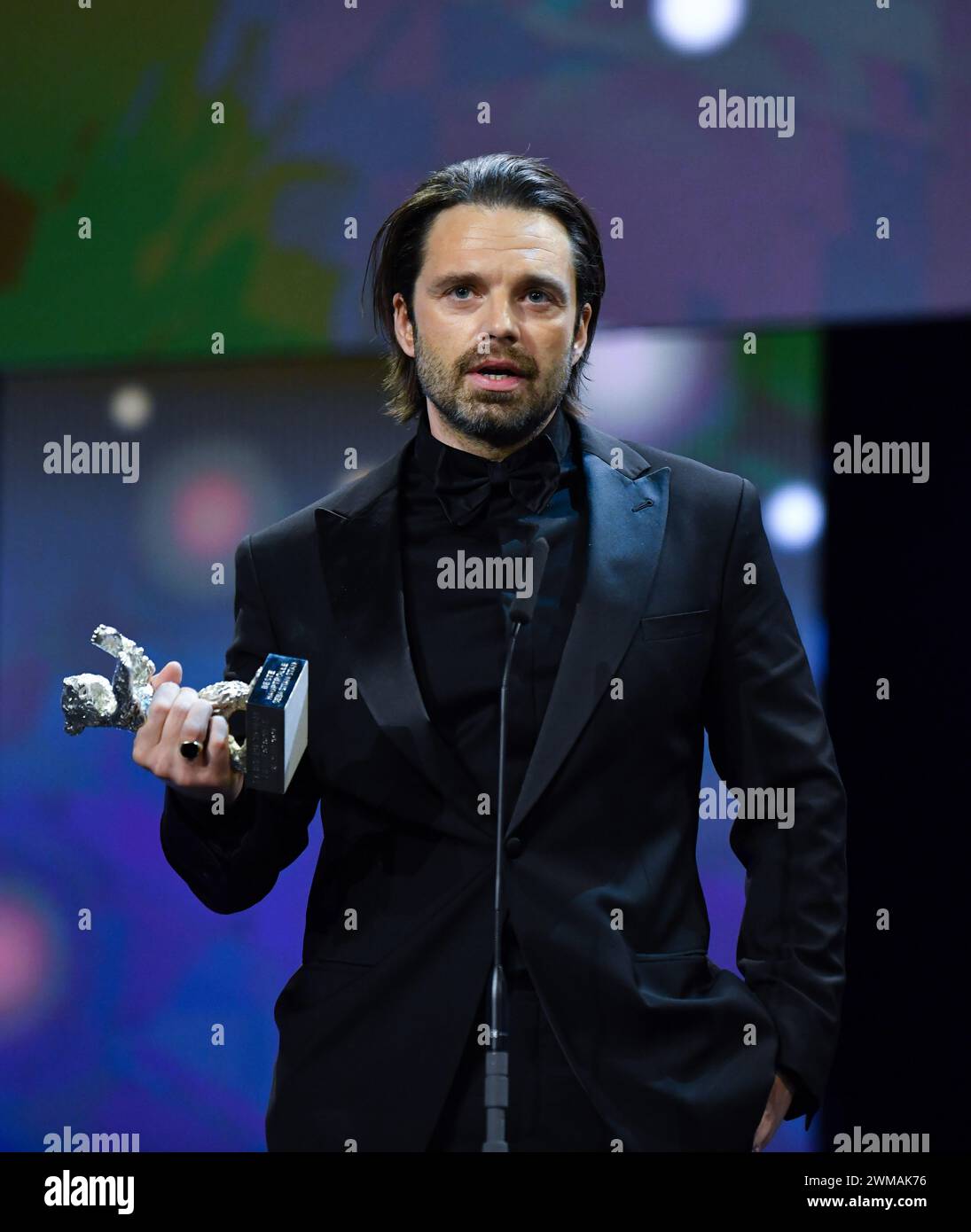 Berlin, Germany. 24th Feb, 2024. Actor Sebastian Stan speaks after receiving the Silver Bear for ...