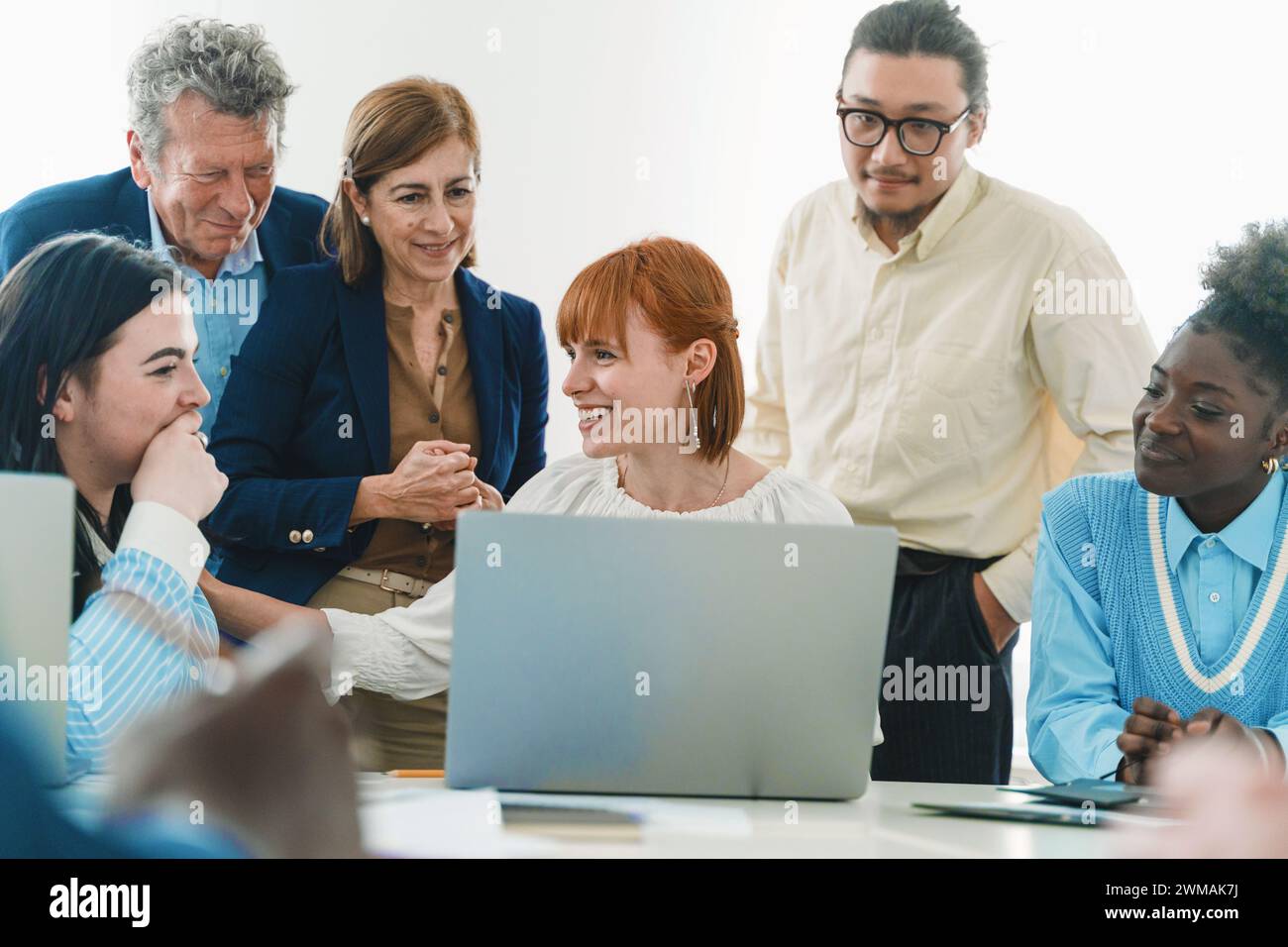 Multicultural colleagues discussing project - Positive feedback in team ...