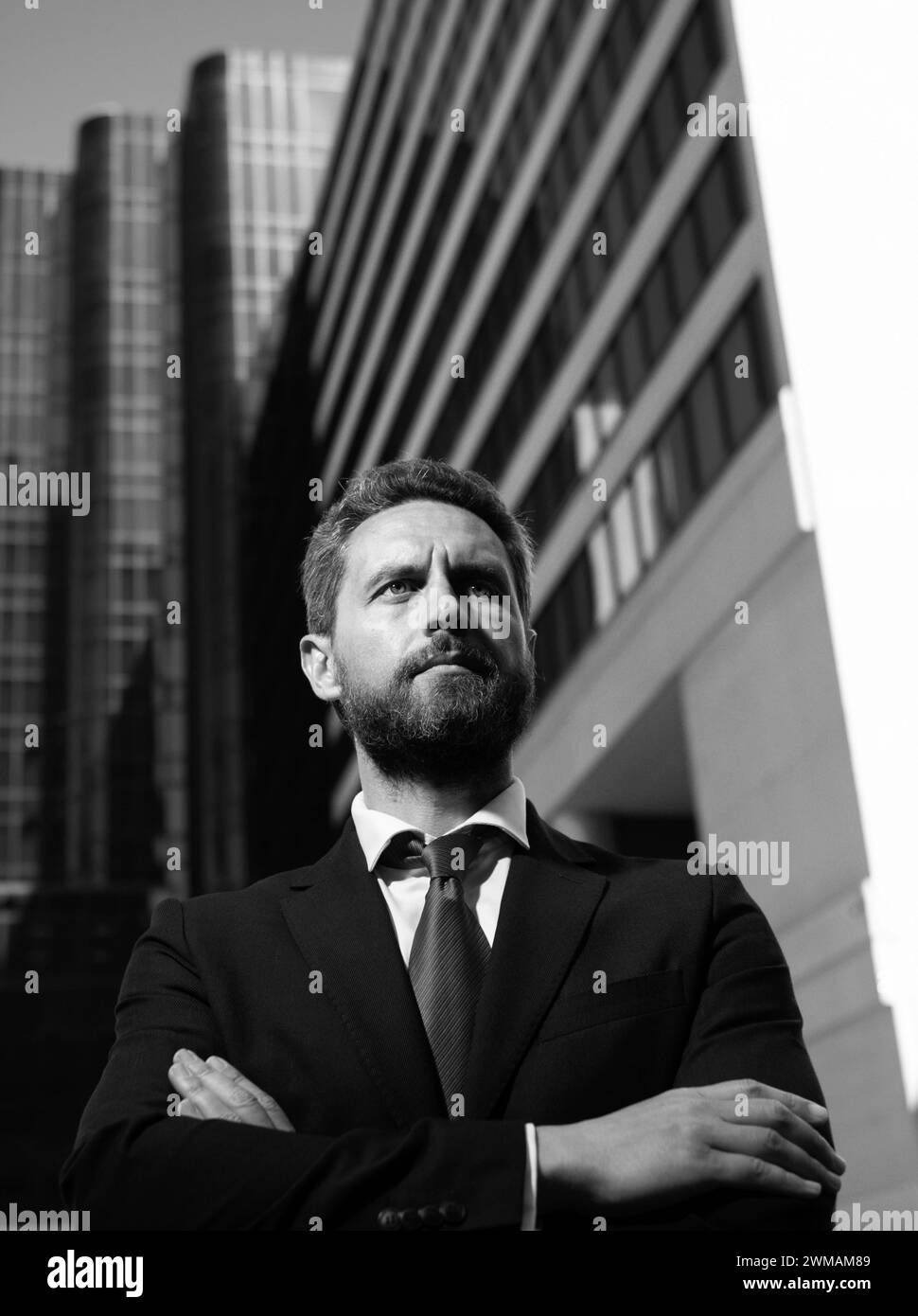 Entrepreneur, business portrait. Businessman standing proud with arms ...