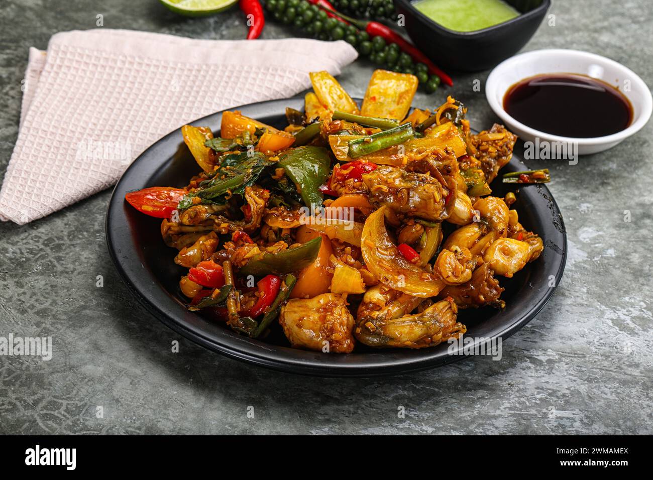 Vietnamese cuisine - fried frog with vegetables and spices Stock Photo ...