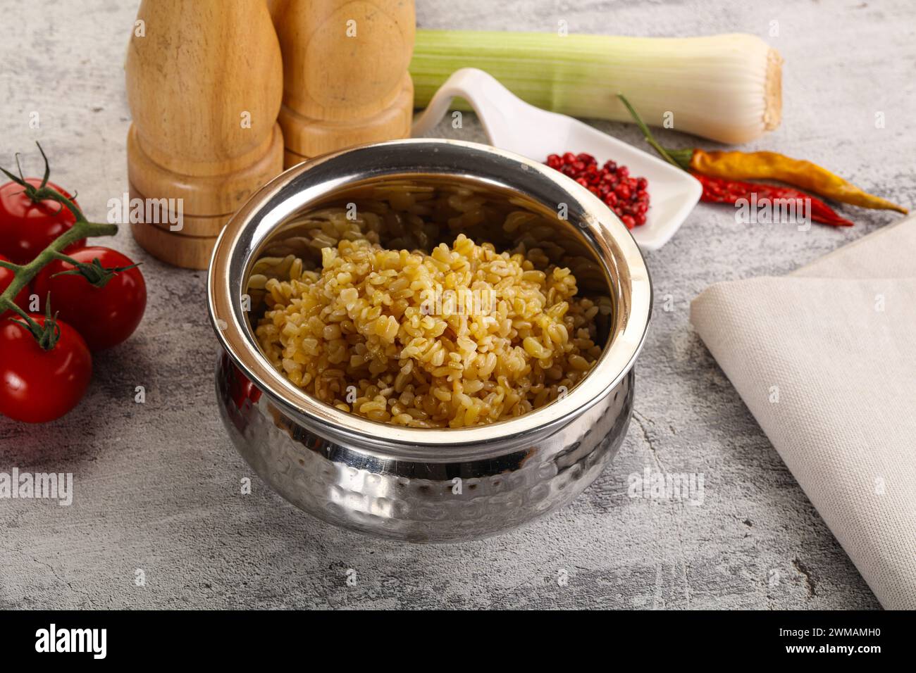 Boiled bulgur wheat in the bowl garnish Stock Photo - Alamy