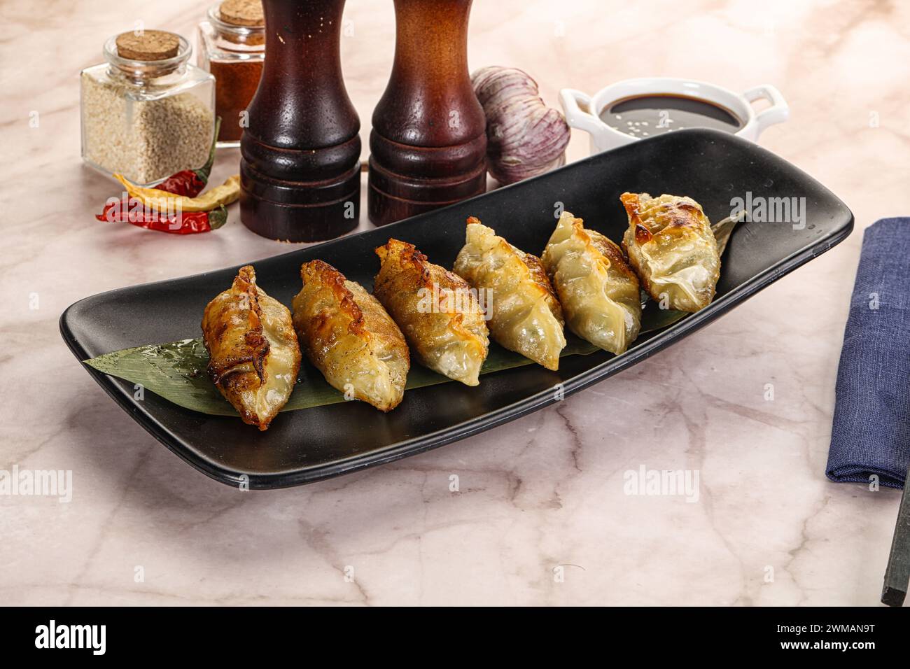 Fried Japanese stuffed dumplings - Gyoza with meat Stock Photo - Alamy