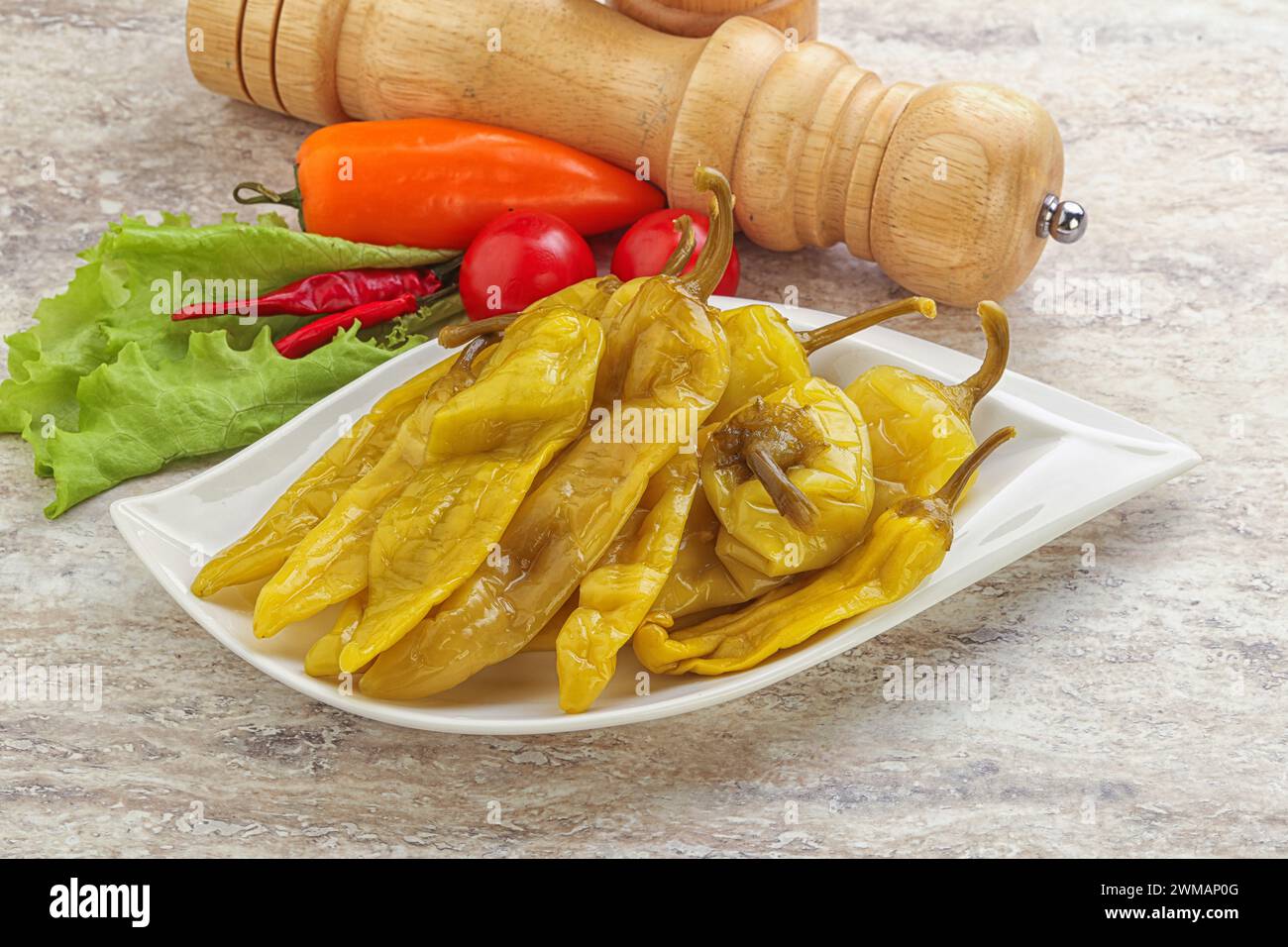 Pickled marinated spicy green pepper snack Stock Photo - Alamy