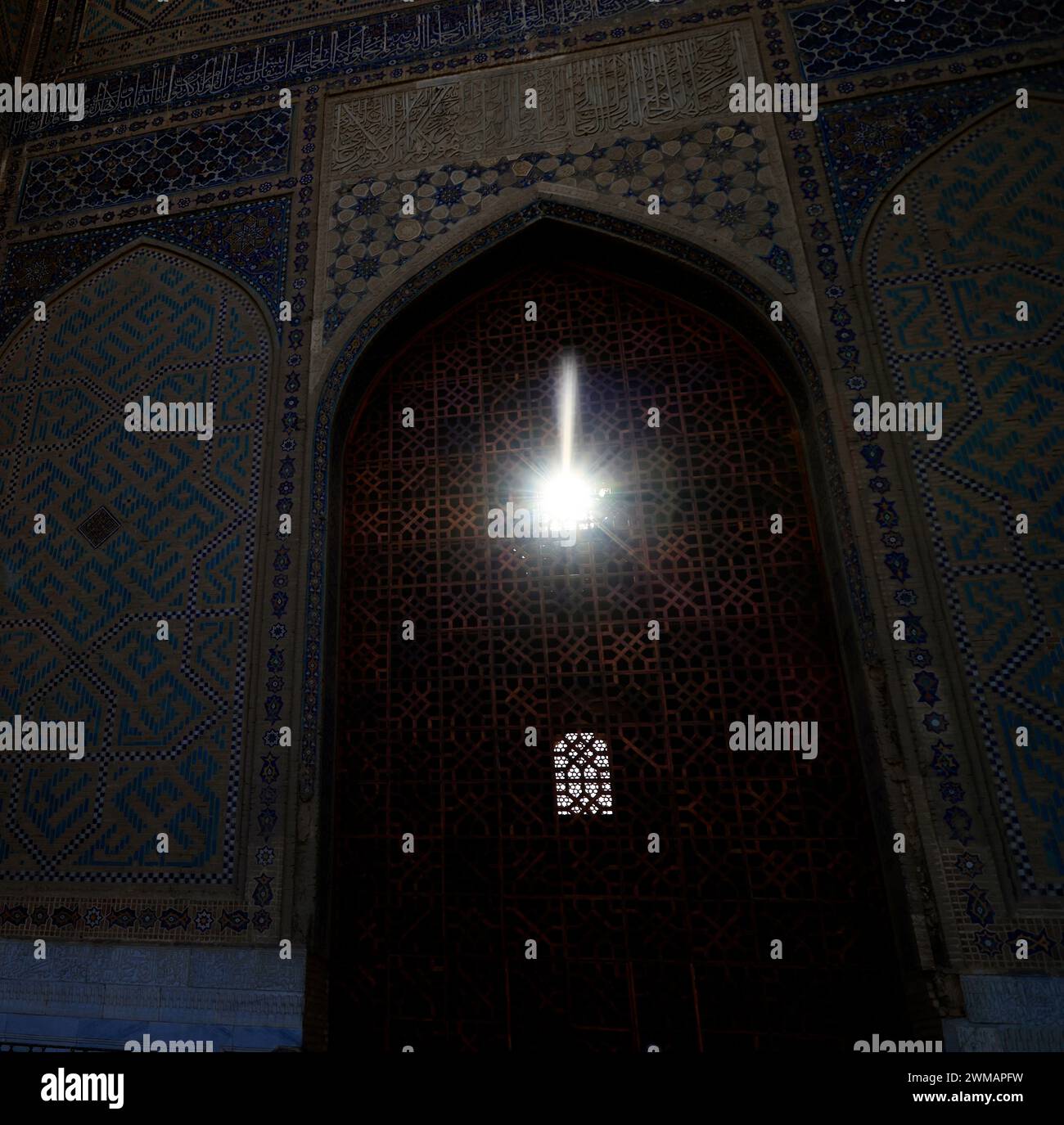 The sun through the gate of the Bibi Khanym Mosque, Samarkand ...