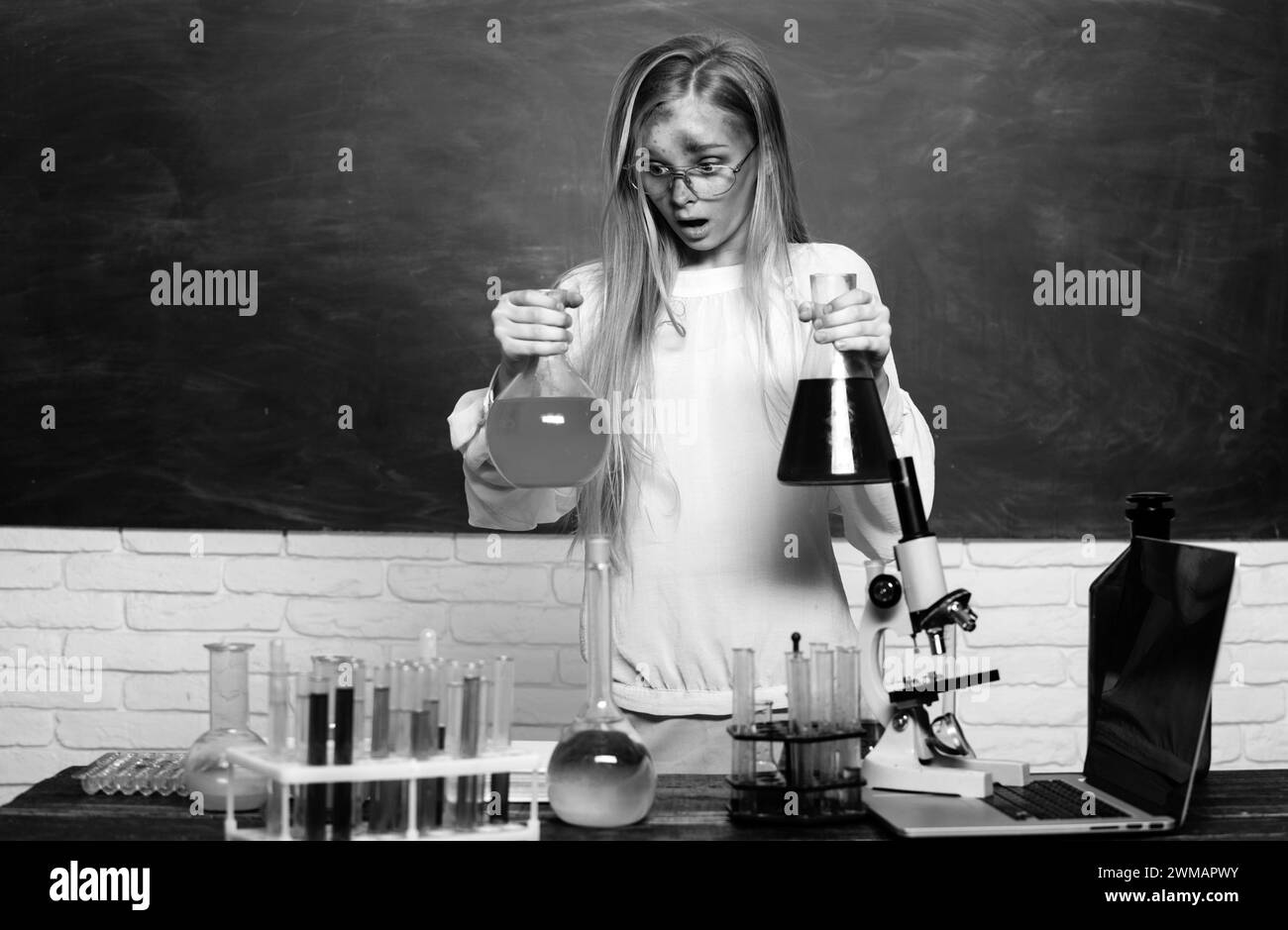 Chemical experiment. Funny schoolgirl kid doing experiments in the ...