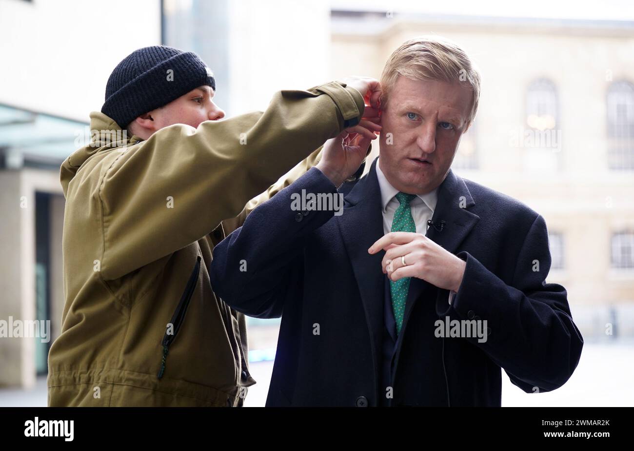 Deputy Prime Minister Oliver Dowden prepares to speak to the media as ...
