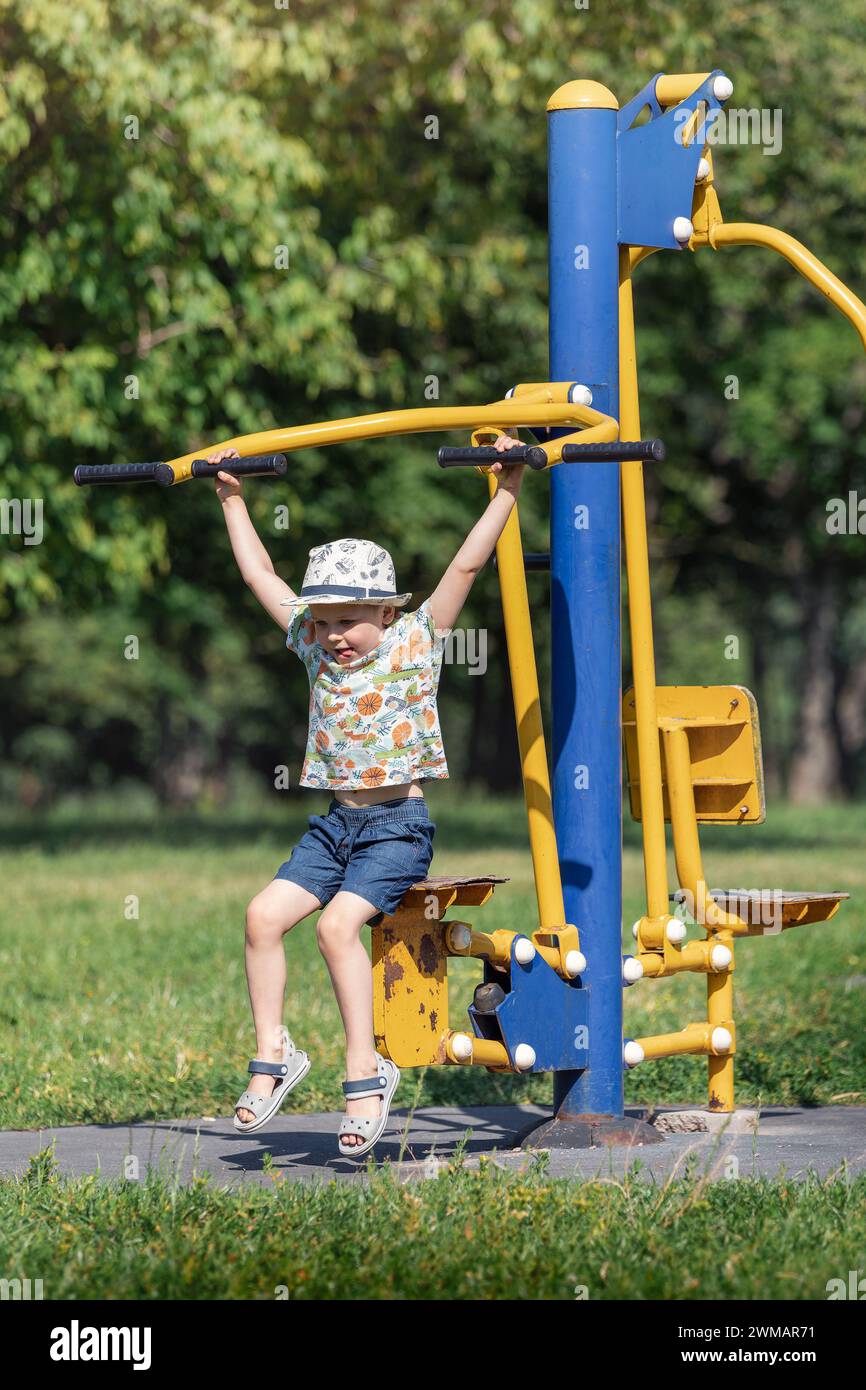 An active and very energetic child is training outdoors Stock Photo - Alamy