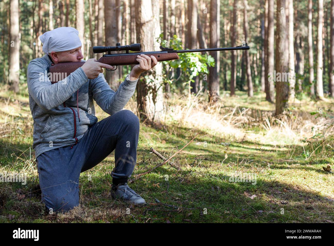 The man Shooting from a gun. Training shooting from an air rifle in the ...