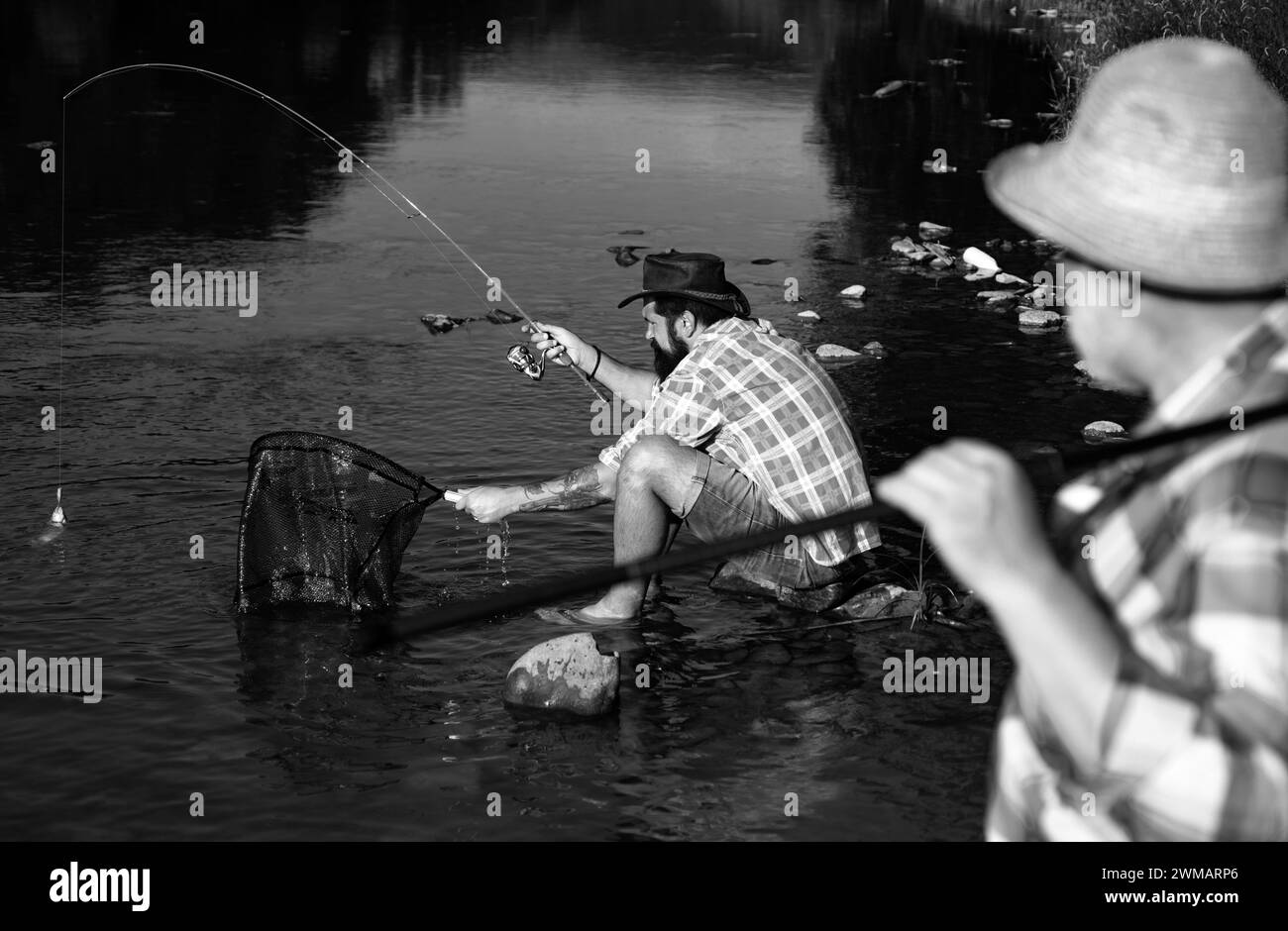 Fisherman men friends and trophy trout. Father and son fishing ...