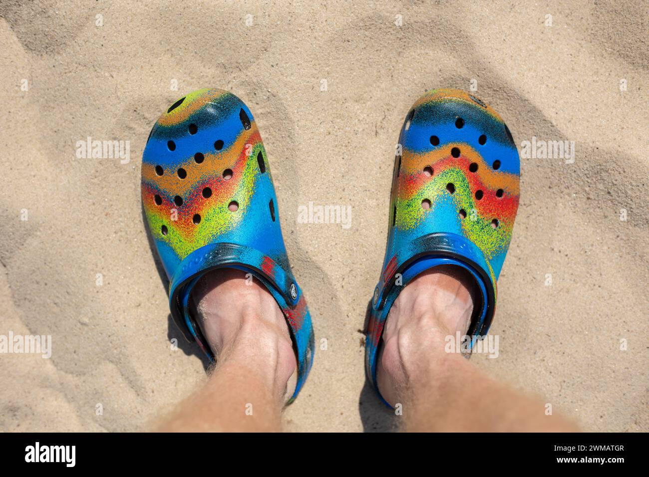 Ukraine, Kyiv - July 04. 2022: Legs in colorful crocs footwear on the ...