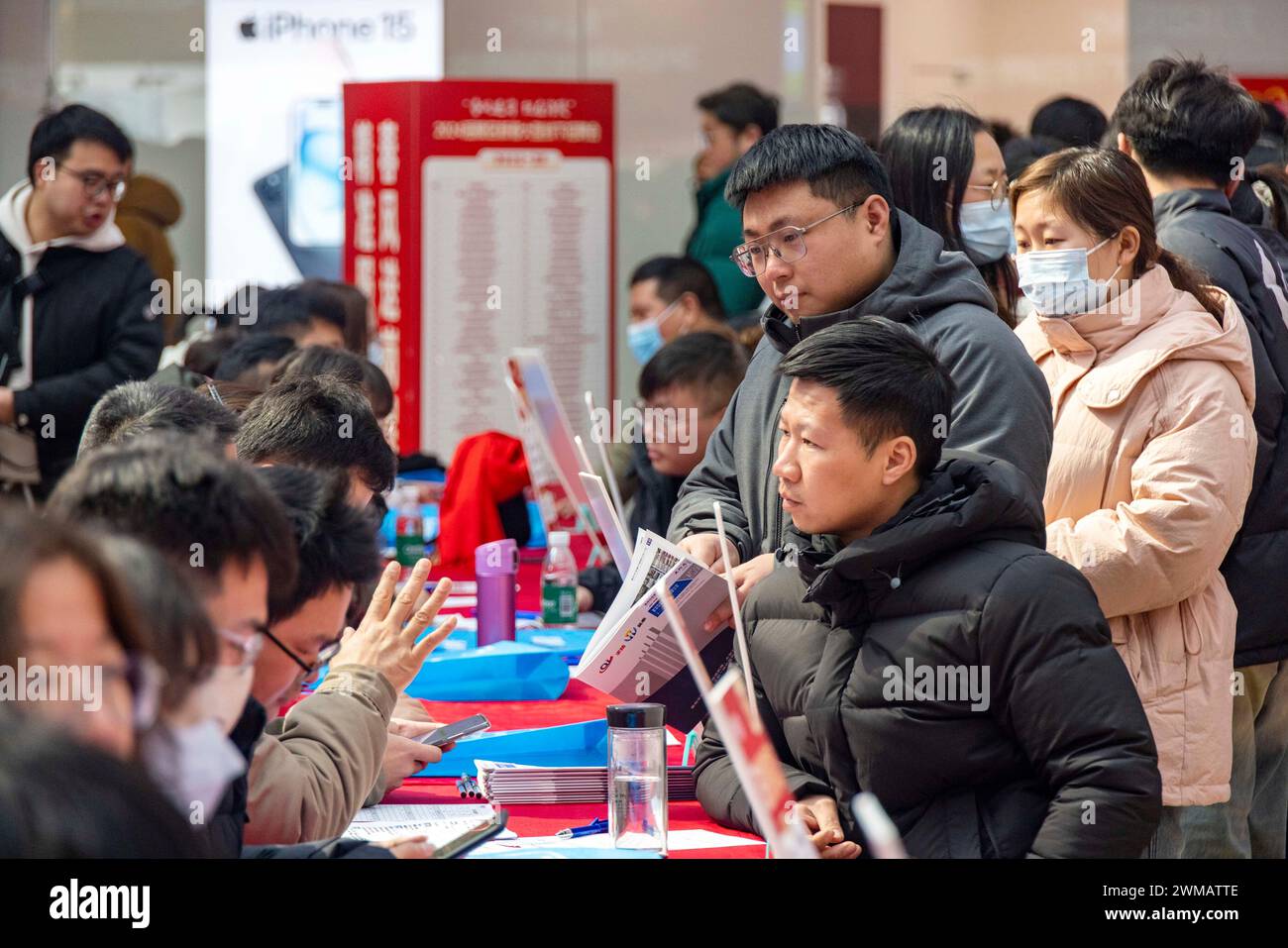 Job-seekers talk with recruiters at a job fair in Taizhou in east China ...