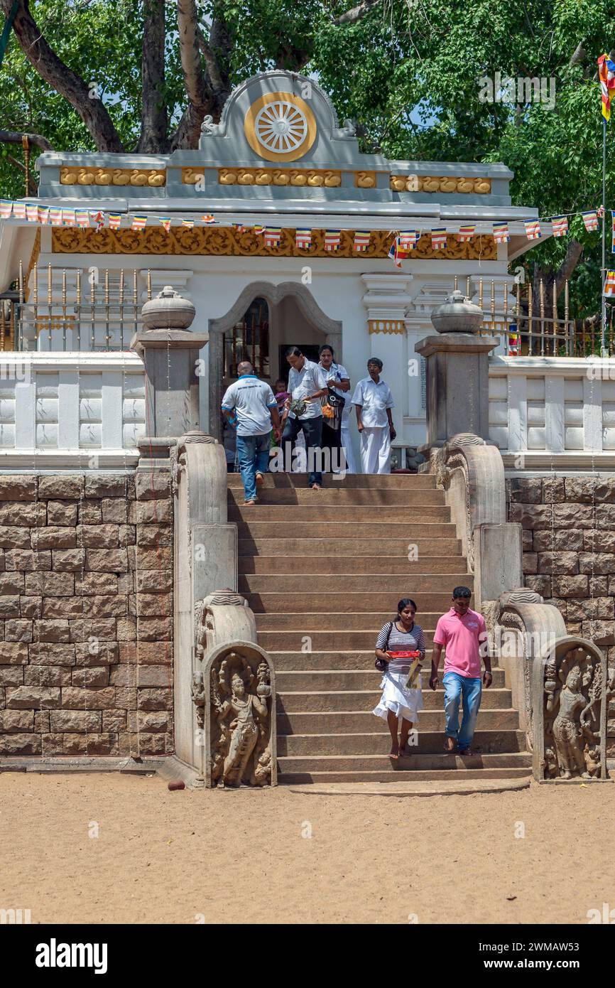 Buddhist pilgrims gather at the Mahavihara which sits adjacent to the ...