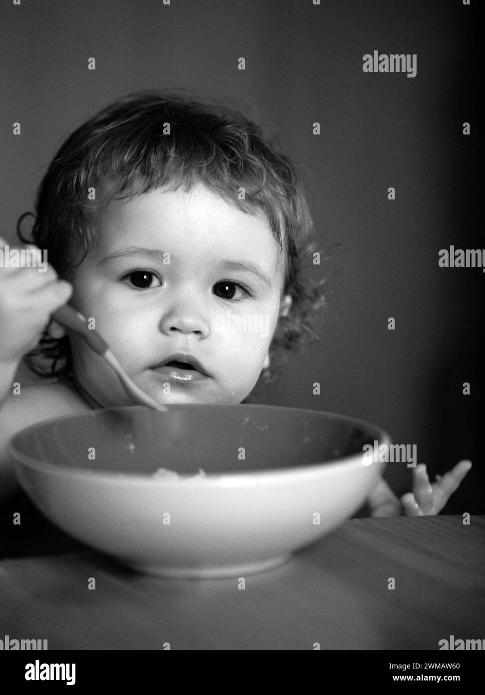 Kid eats breakfast kitchen Black and White Stock Photos & Images - Alamy