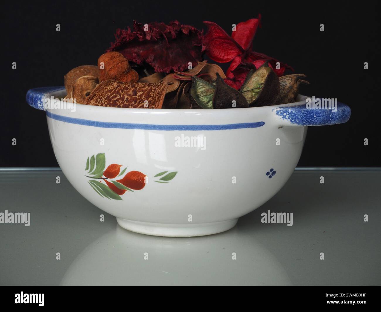 A pot-pourri arrangement, the content derived from dried naturally ...