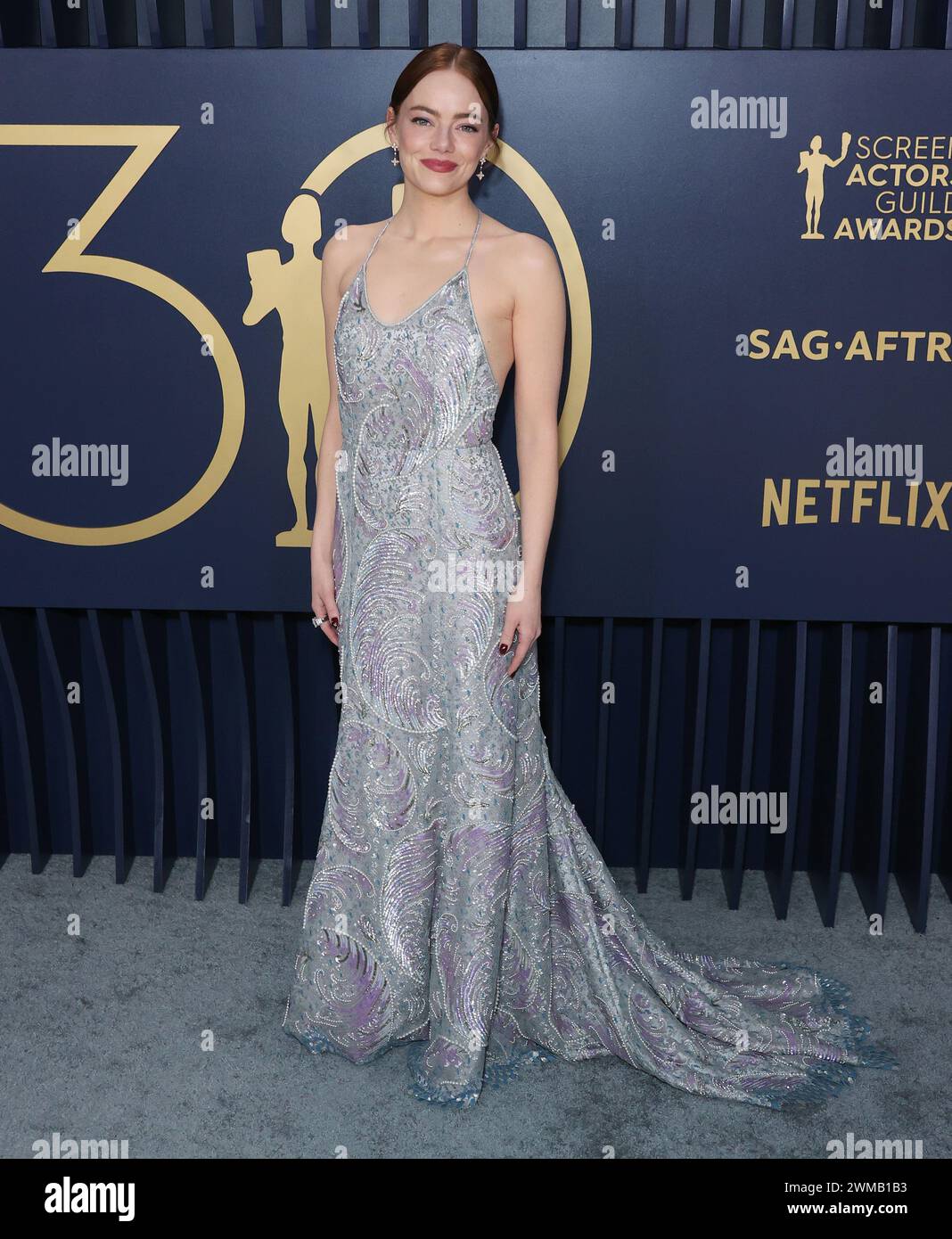 LOS ANGELES, CALIFORNIA, USA - FEBRUARY 24: Emma Stone wearing a Louis ...