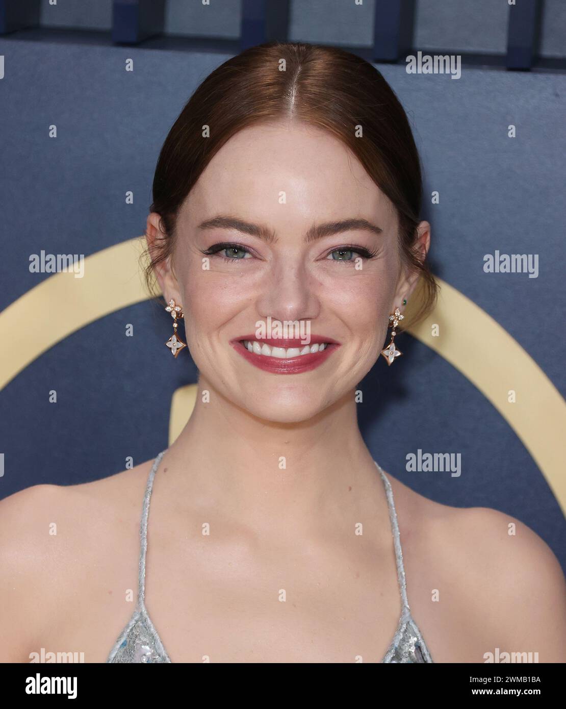 LOS ANGELES, CALIFORNIA, USA - FEBRUARY 24: Emma Stone wearing a Louis ...