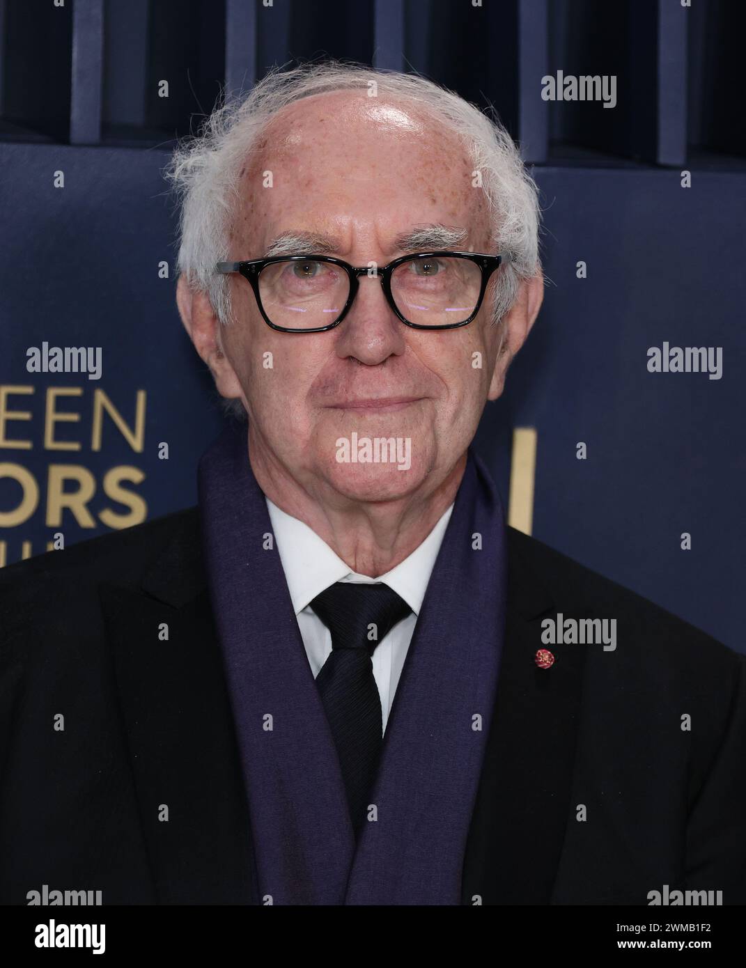 LOS ANGELES, CALIFORNIA, USA - FEBRUARY 24: Jonathan Pryce arrives at ...