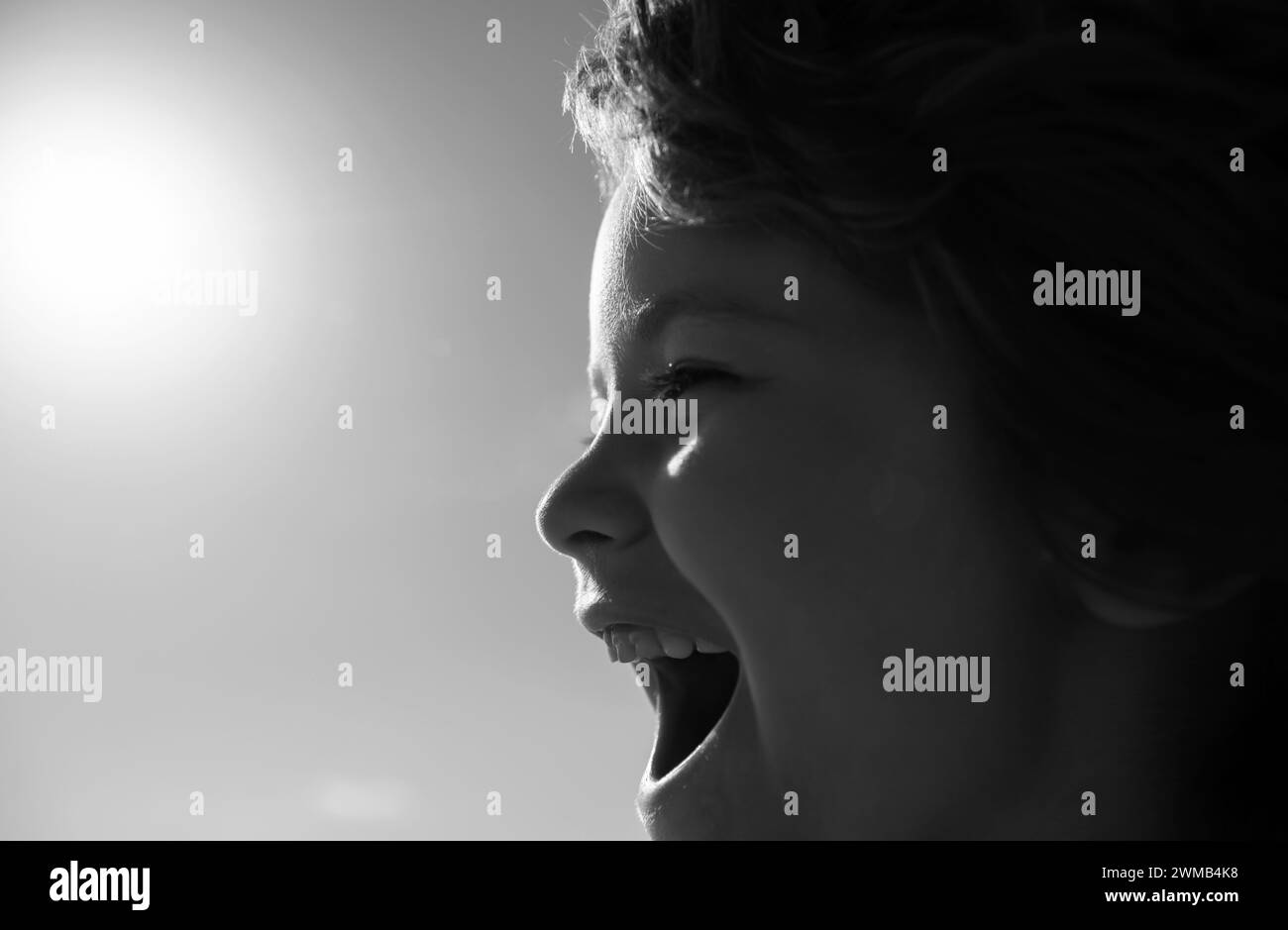 Portrait of a happy laughing child. Close up positive kid screaming ...