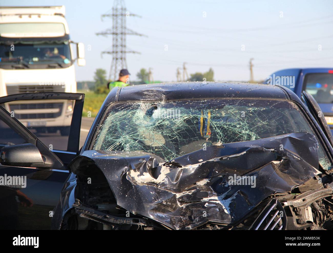 The mangled front part of a car after a head-on crash accident with a ...