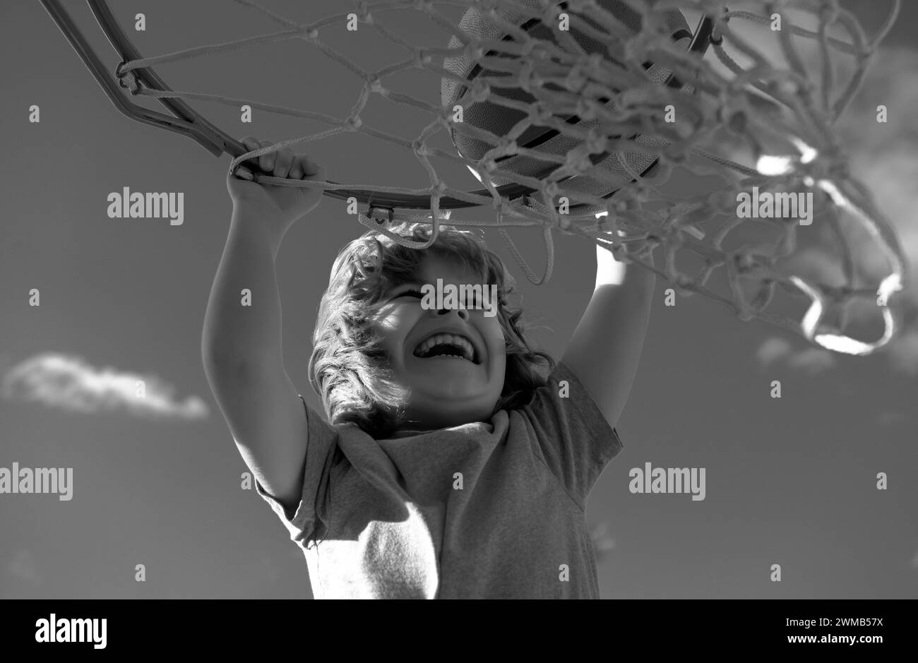 Excited funny kid playing basketball. Closeup child portrait. Funny ...