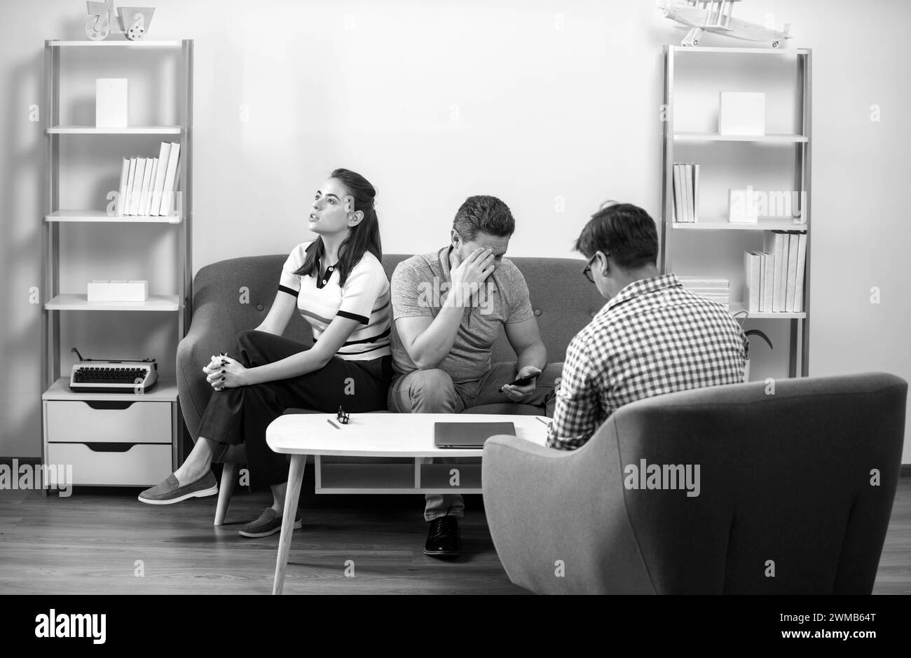 Depressed young man and therapist Black and White Stock Photos & Images ...