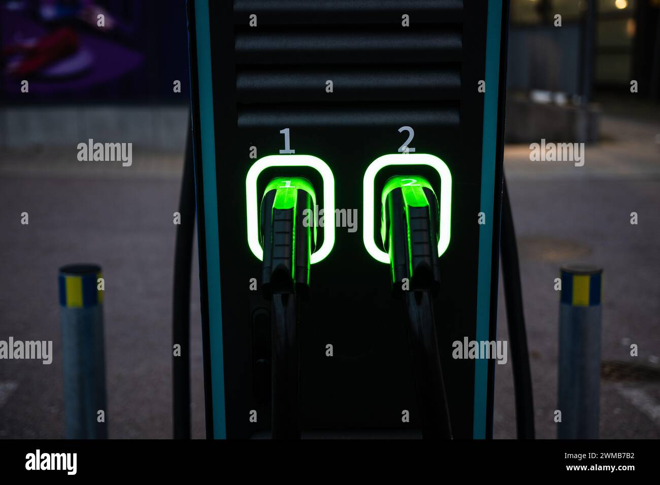 Two charging handles of an electric car charger Stock Photo - Alamy