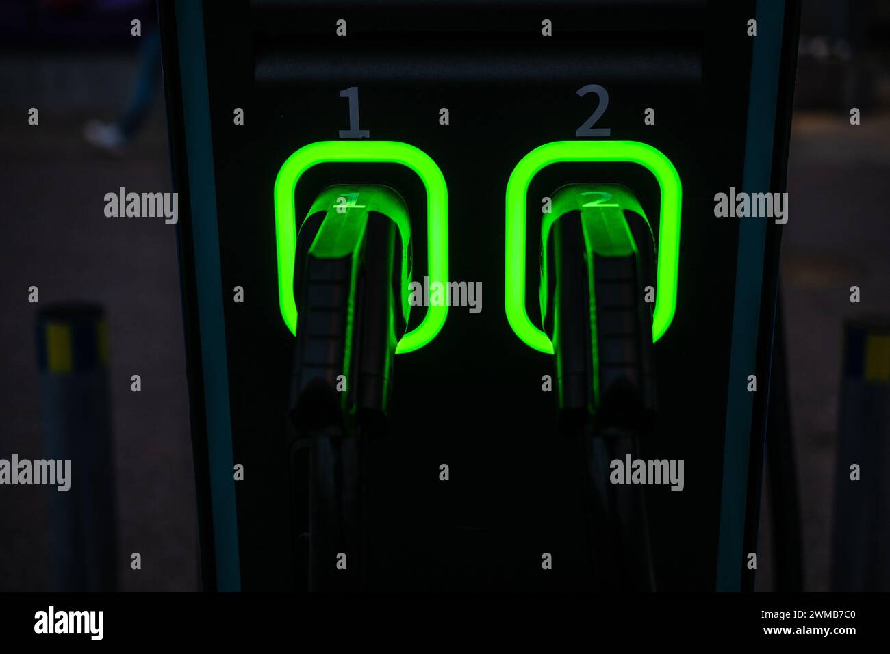 Two charging handles of an electric car charger Stock Photo - Alamy