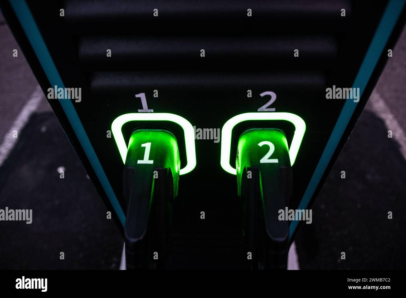 Two charging handles of an electric car charger Stock Photo - Alamy
