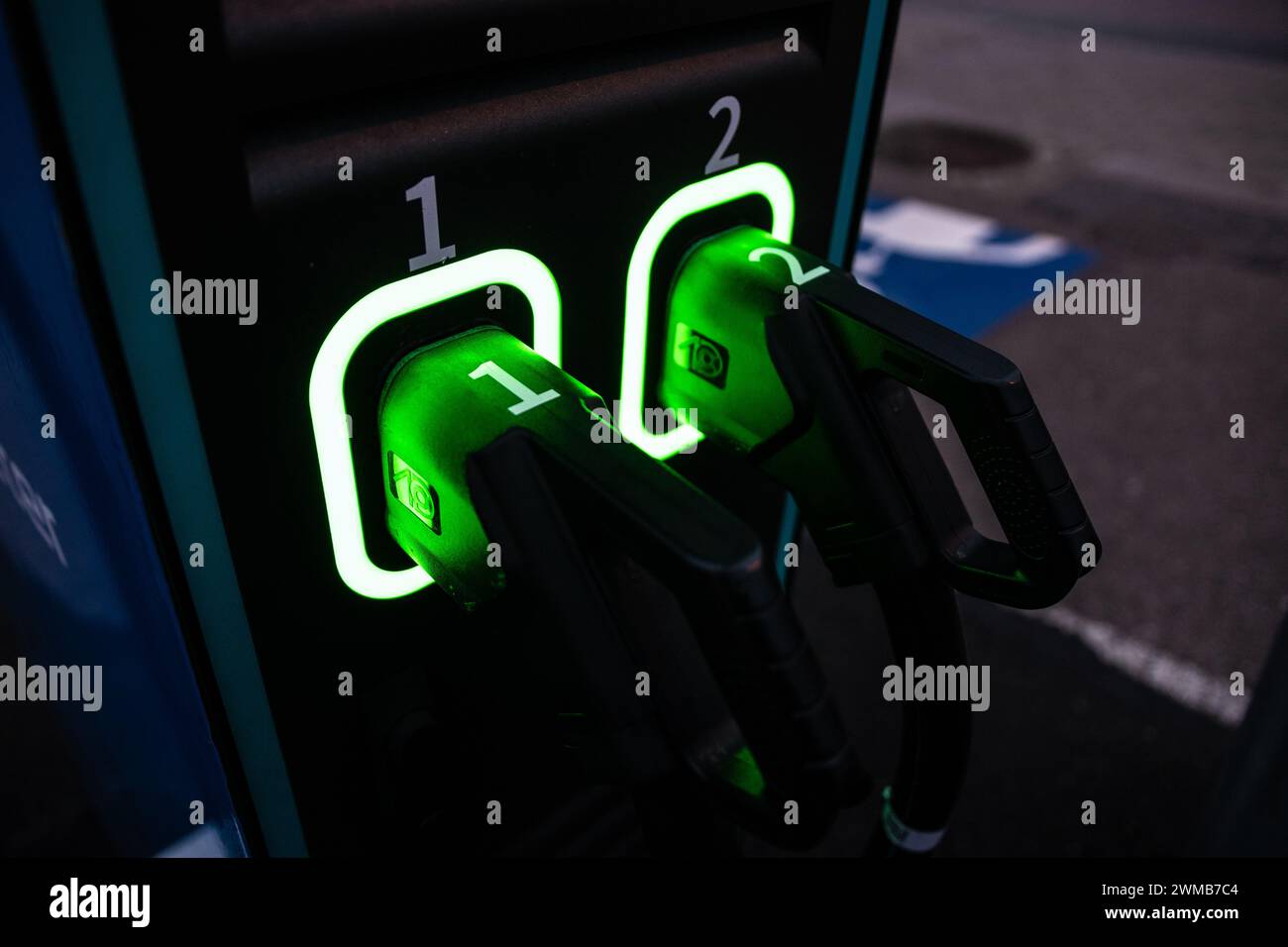 Two charging handles of an electric car charger Stock Photo - Alamy