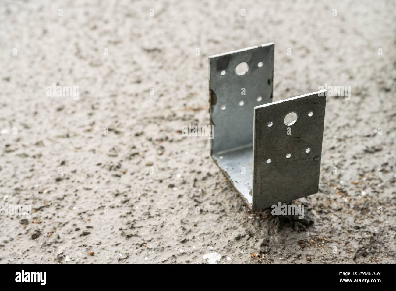 Metal beam fixing set in concrete Stock Photo - Alamy