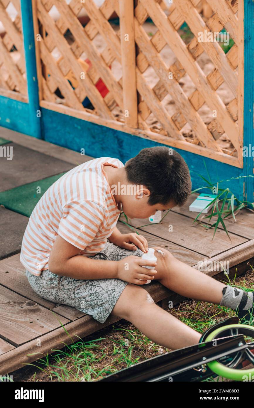 child's leg injury. The child injured his knee when he fell off the ...