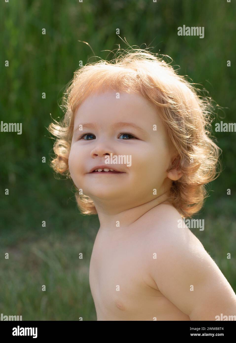 Kids portrait, close up head of cute child in nature park. Baby smiling ...