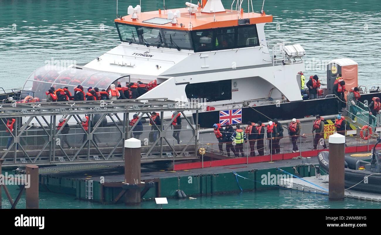 A group of people thought to be migrants are brought in to Dover, Kent ...