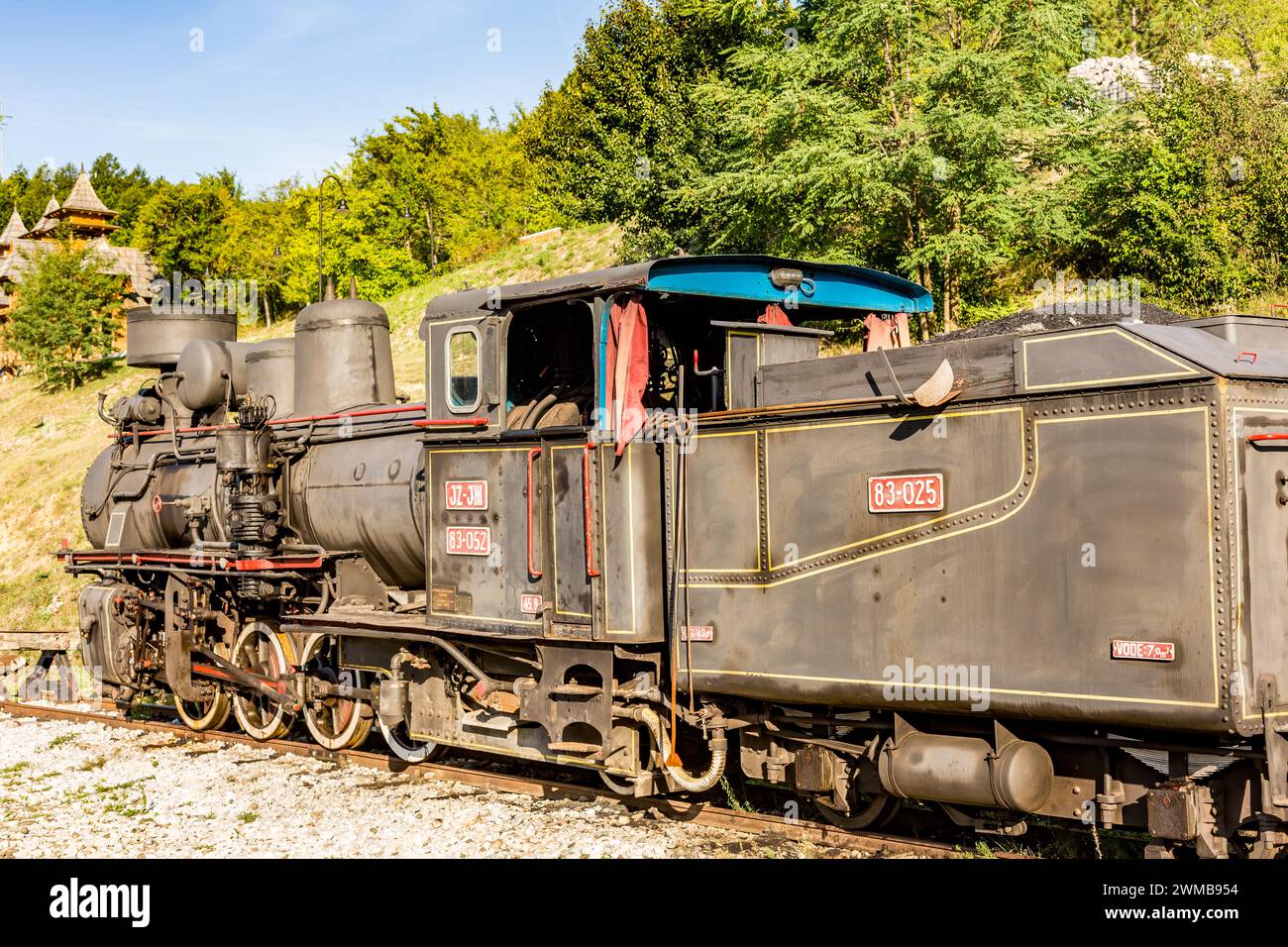 Sunlit old steam locomotive engine at the Mokra Gora tourist train ...