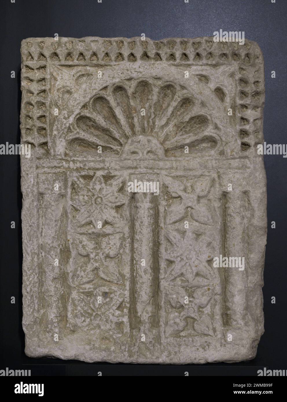 Plaque of chancel decorated with a scallop supported by small columns ...