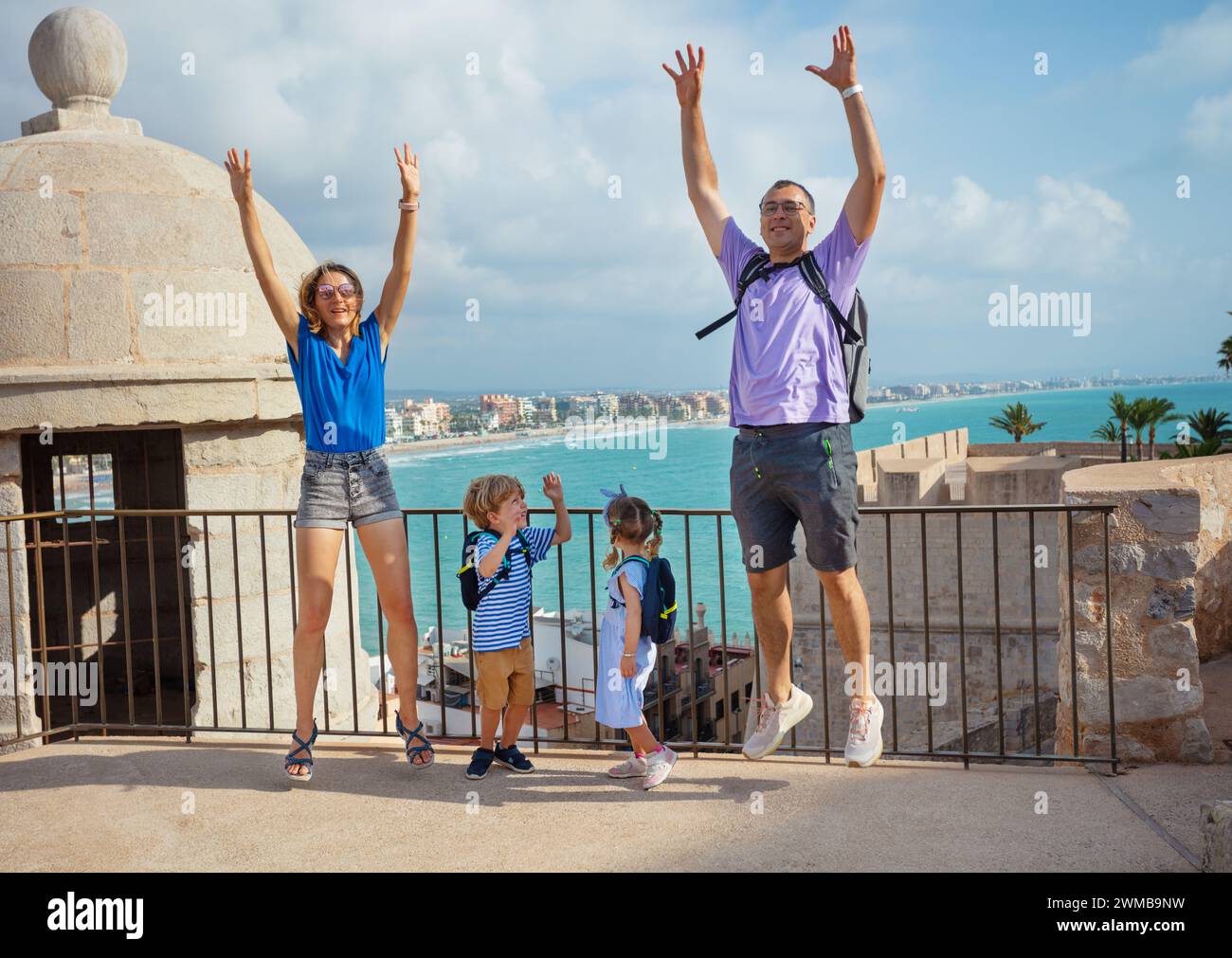 Happy family in Spain jump high excited to be on vacations Stock Photo ...
