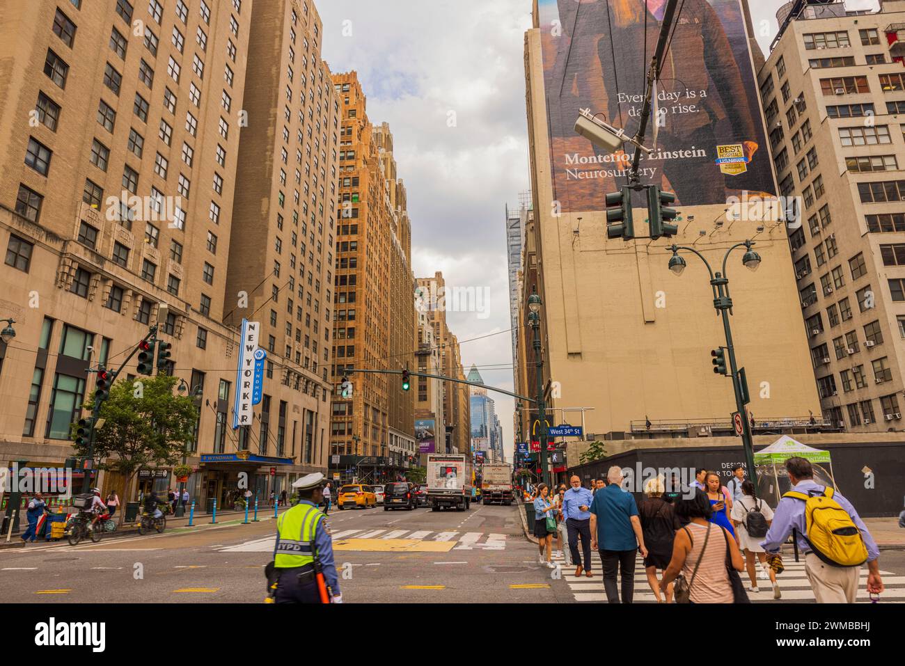 View of an NYPD police officer on Broadway in Manhattan, regulating ...