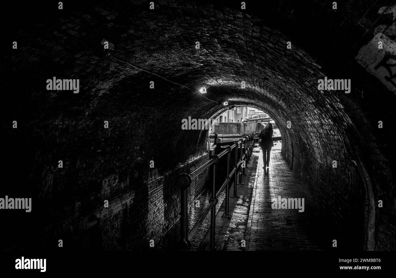 Single female walking long the Birmingham and Fazeley canal Stock Photo ...