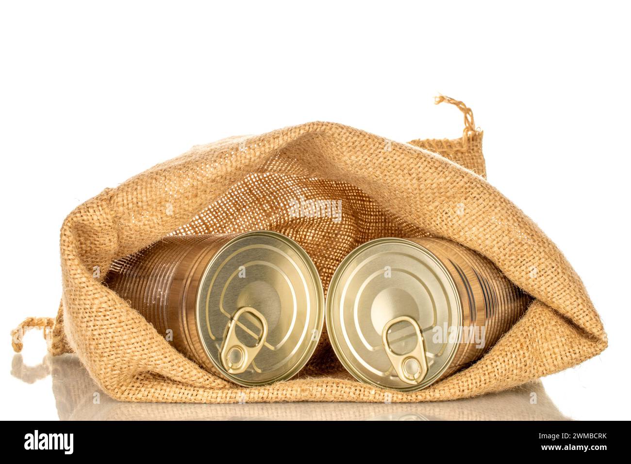 Two metal cans of meat in a jute sack, macro, isolated on white ...