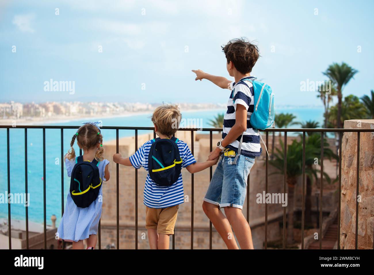 Kids enjoy Spain's coast stand on Peniscola castle viewpoint Stock ...