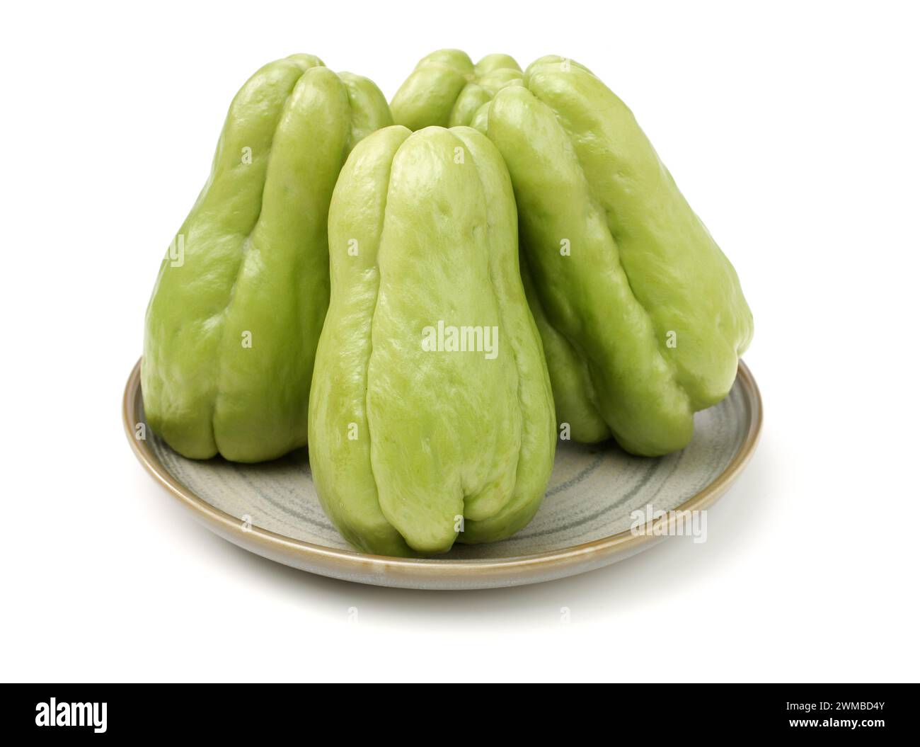 Chayote on a white background Stock Photo - Alamy