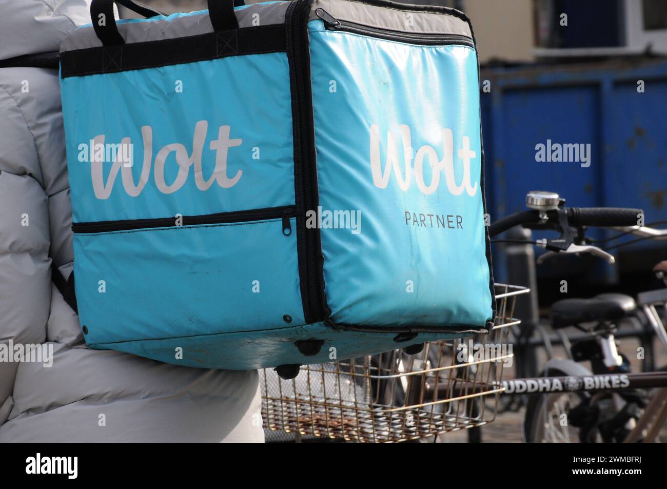 Copenhagen, Denmark /25 February 2024/. Wolt partner food delivery bikers and store in danish ...
