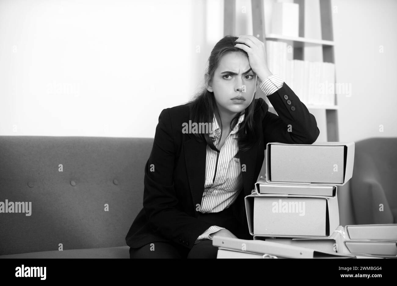 Upset business woman on folders with the documents, unhappy secretary ...